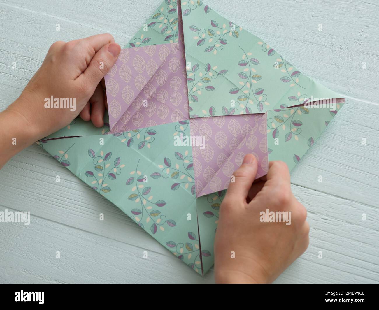 Paper Craft. DIY Origami Gift box Step 7 Stock Photo - Alamy
