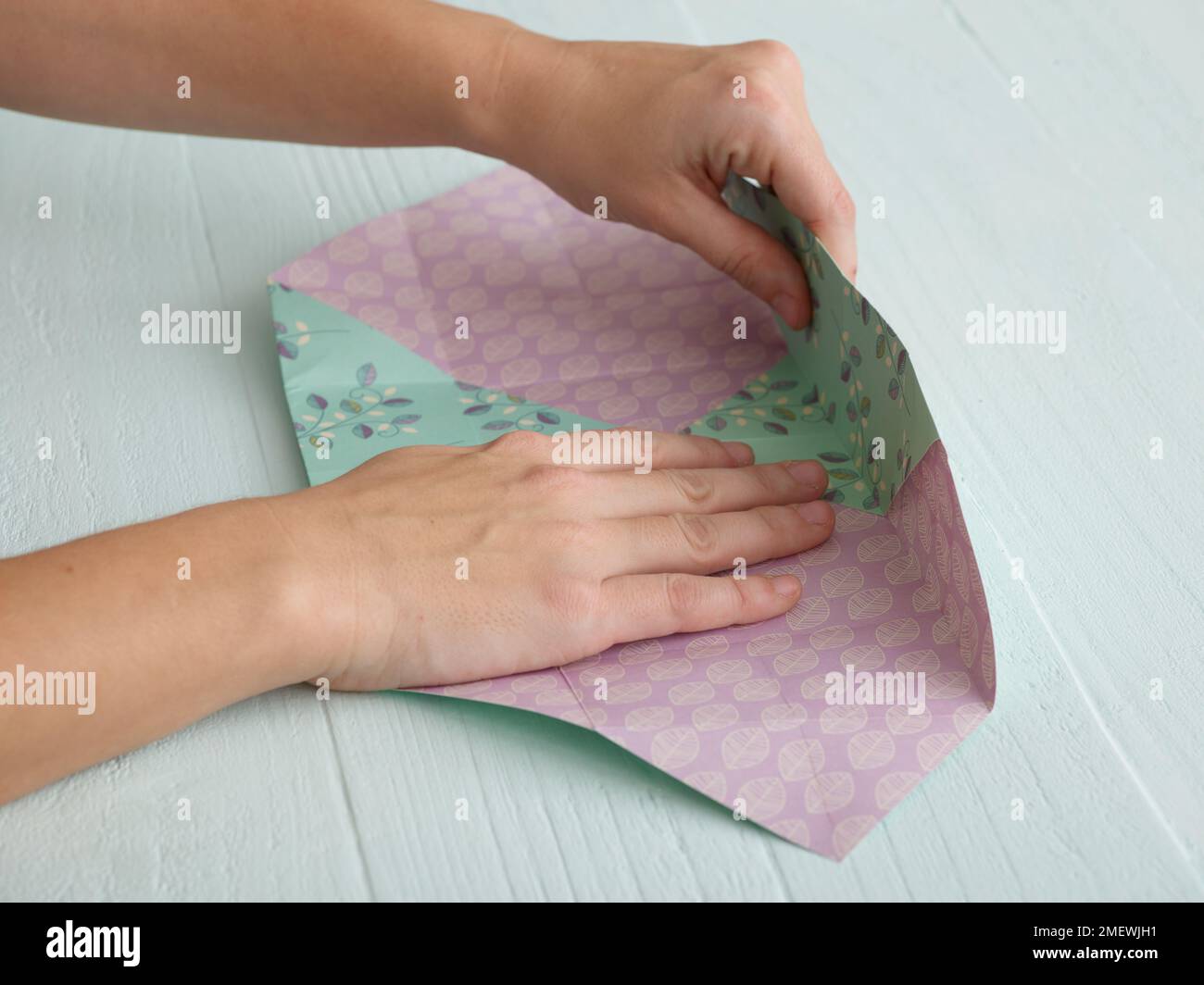 Paper Craft. DIY Origami Gift box Step 8 Stock Photo - Alamy