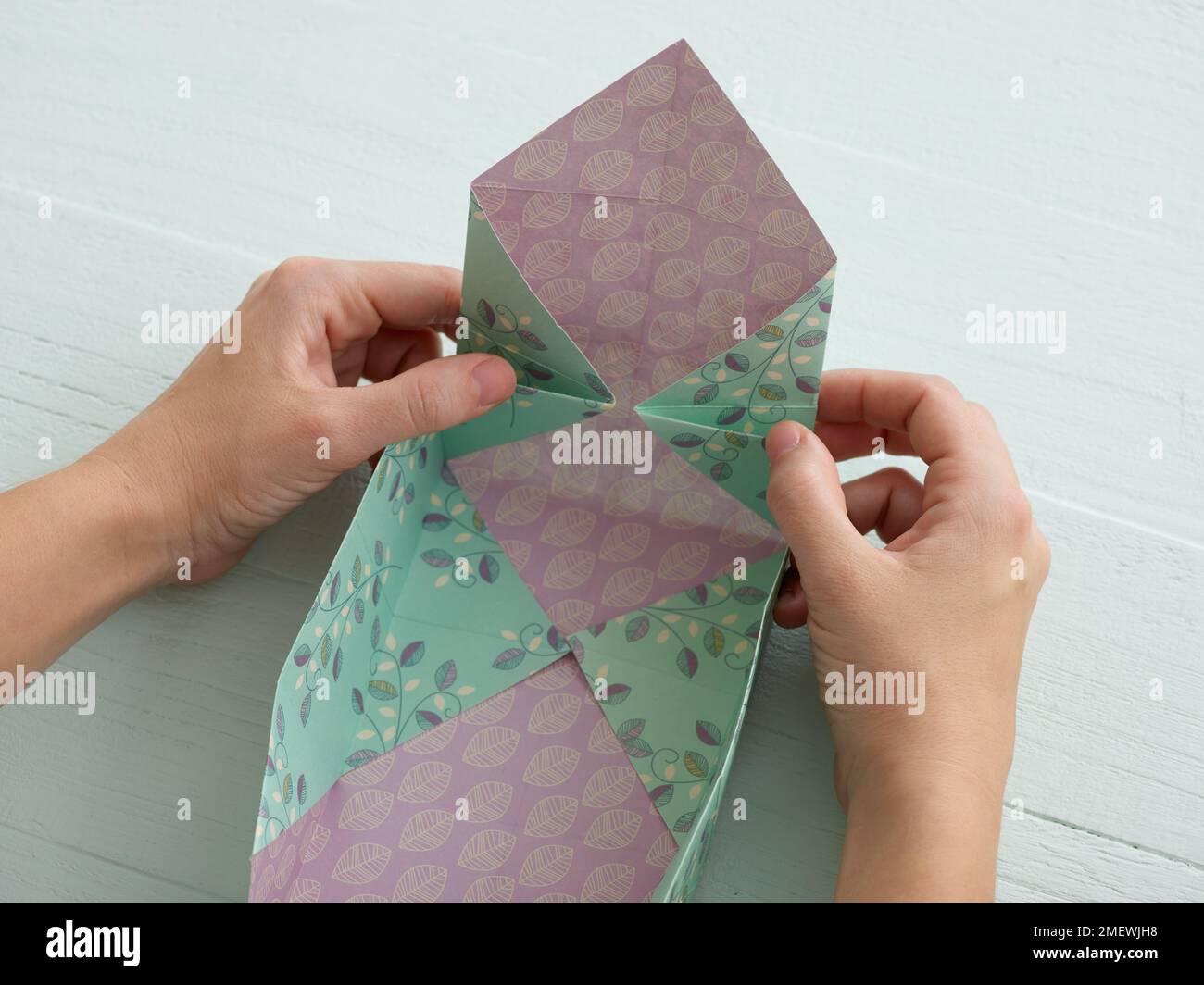 Paper Craft. DIY Origami Gift box Step 10 Stock Photo - Alamy