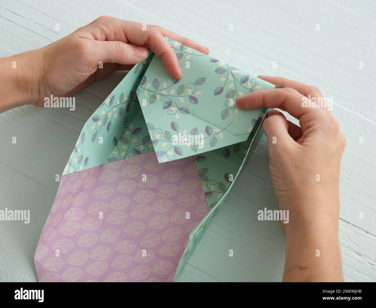 Paper Craft. DIY Origami Gift box Step 11 Stock Photo - Alamy
