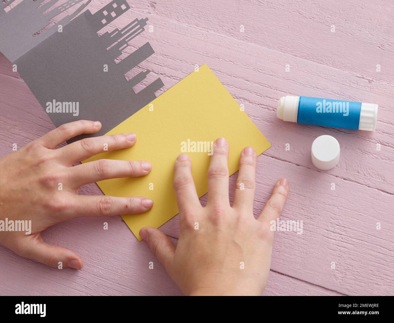 Paper Craft. DIY Concertina City Card Step 6 Stock Photo - Alamy