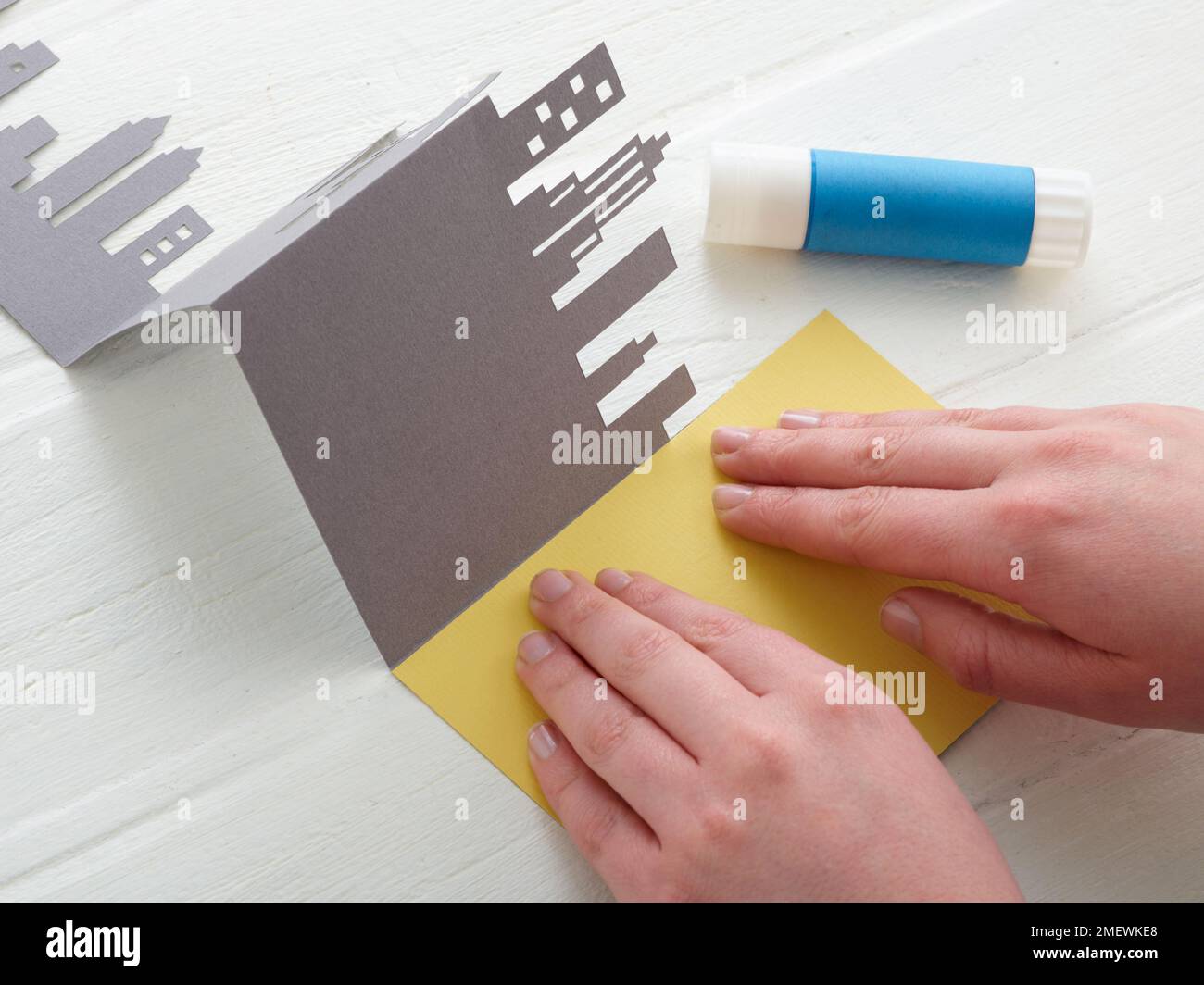 Paper Craft. DIY Concertina City Card Step 6 Stock Photo - Alamy