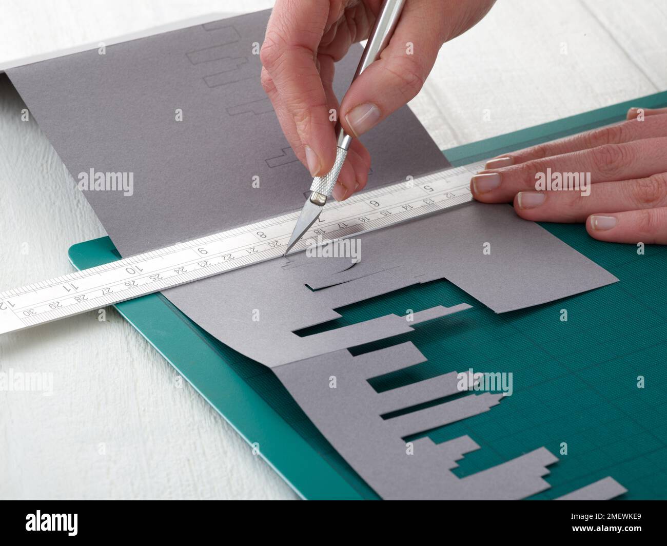 Paper Craft. DIY Concertina City Card Step 5 Stock Photo - Alamy