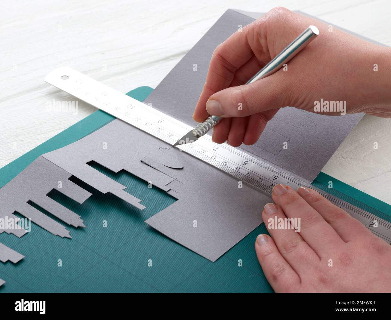 Paper Craft. DIY Concertina City Card Step 5 Stock Photo - Alamy
