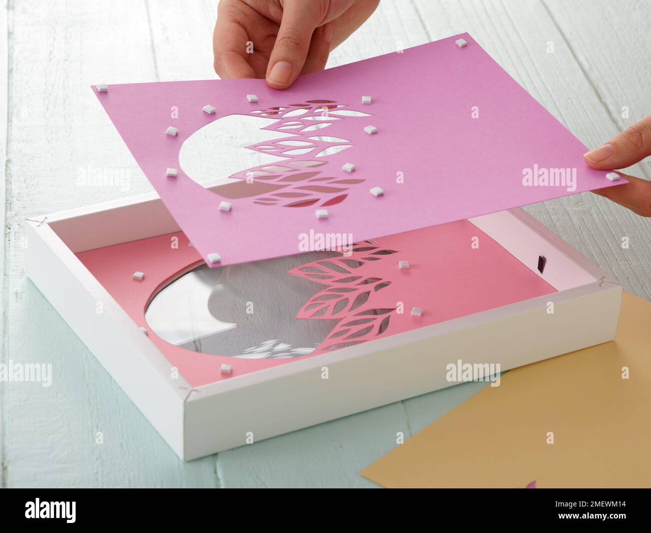 Paper Craft. DIY Layered Paper Cut Frame Step 8 Stock Photo - Alamy