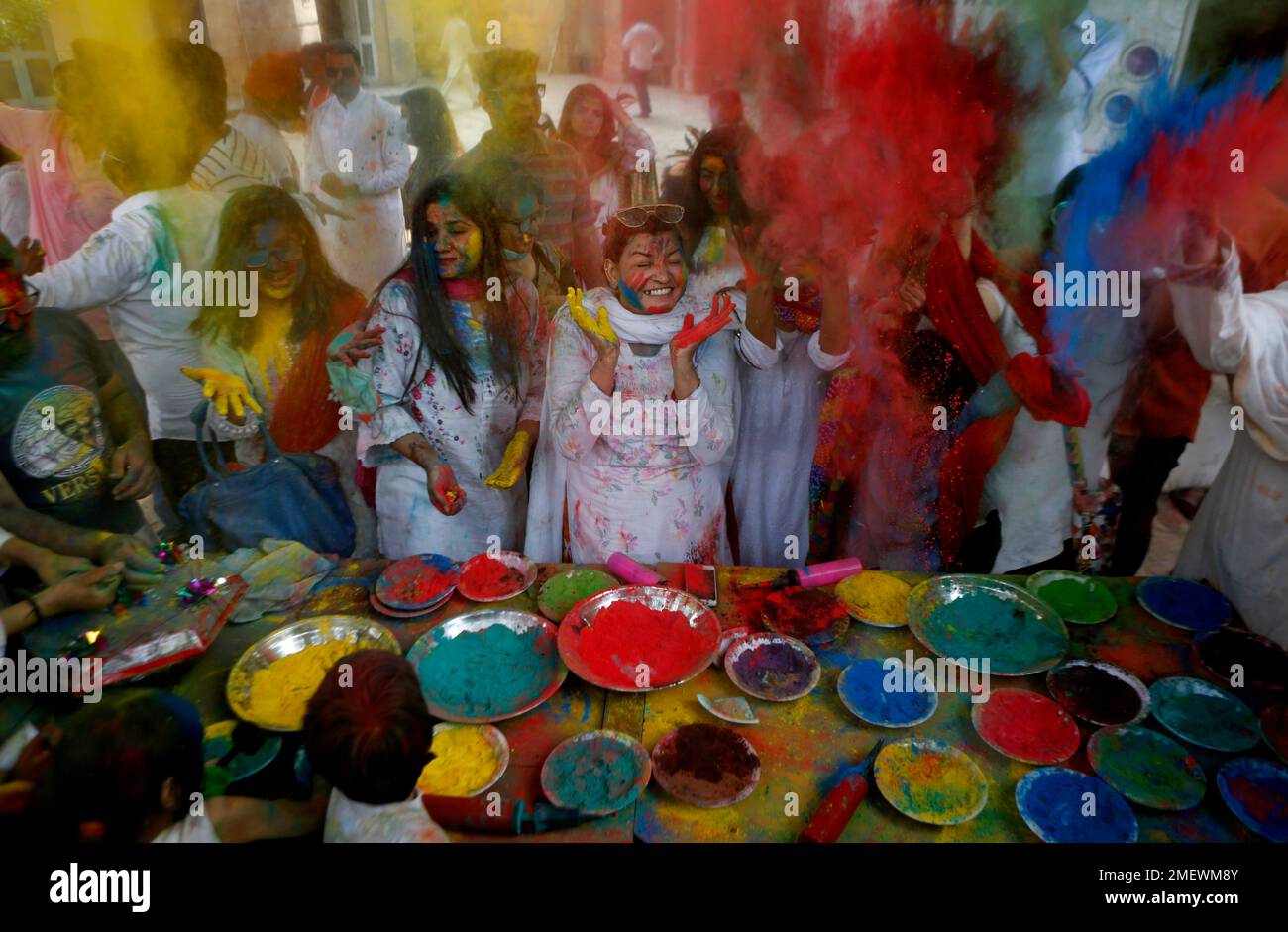 Pakistanis celebrate Holi, the Hindu festival of colors, at a temple in ...