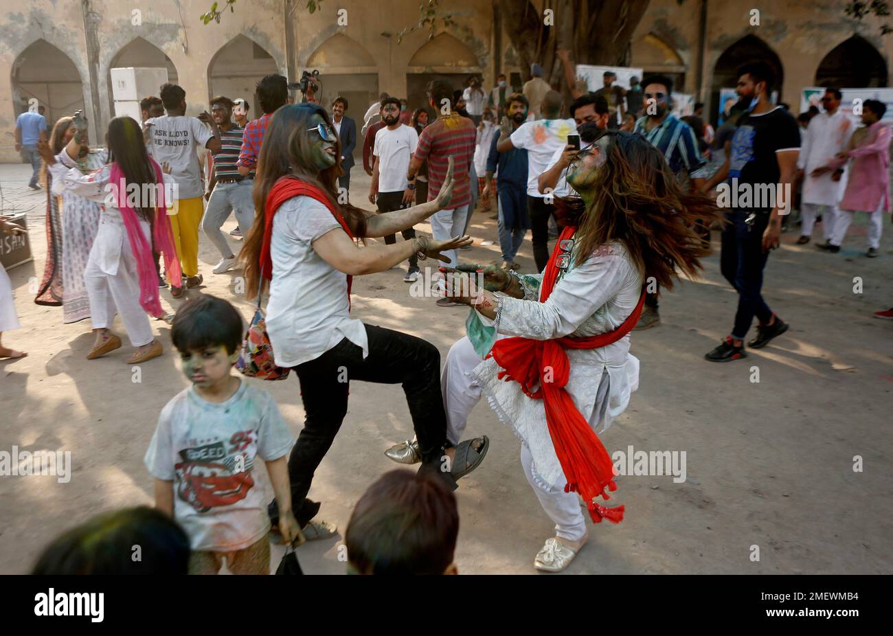 Pakistanis dance to celebrate Holi, the Hindu festival of colors, at a ...