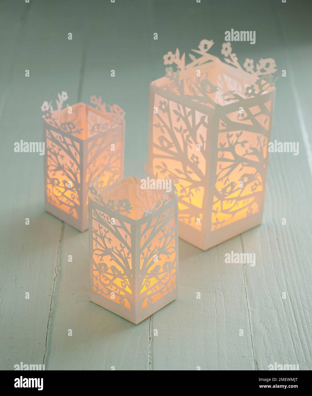 Papercraft. DIY Paper Lantern on painted wood background Stock Photo ...