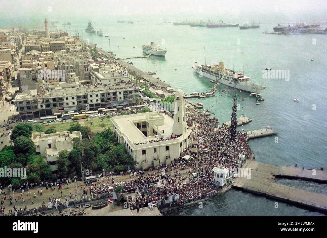 FILE - In this June 5, 1975 file photo, thousands throng the docks and ...