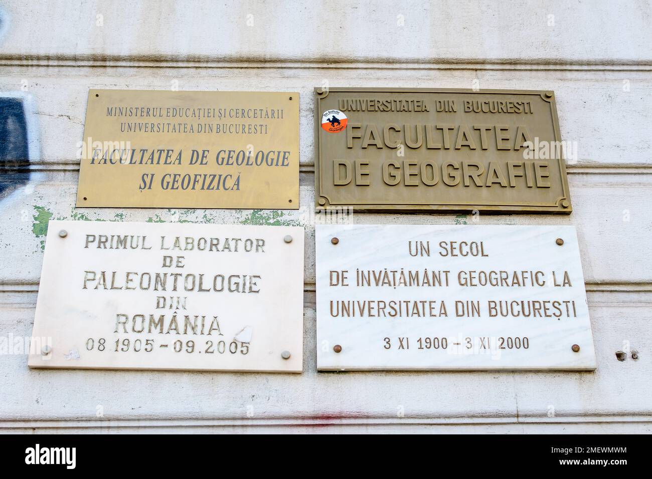 Old signs on the University of Bucharest showing different areas of the Faculty of Geography ...