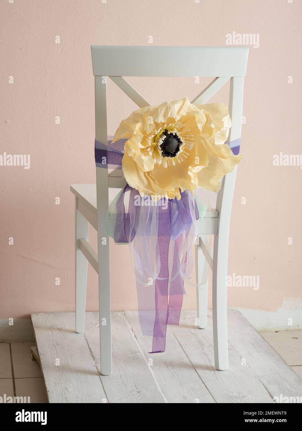 Papercraft Giant Poppy wedding chair decoration Stock Photo - Alamy