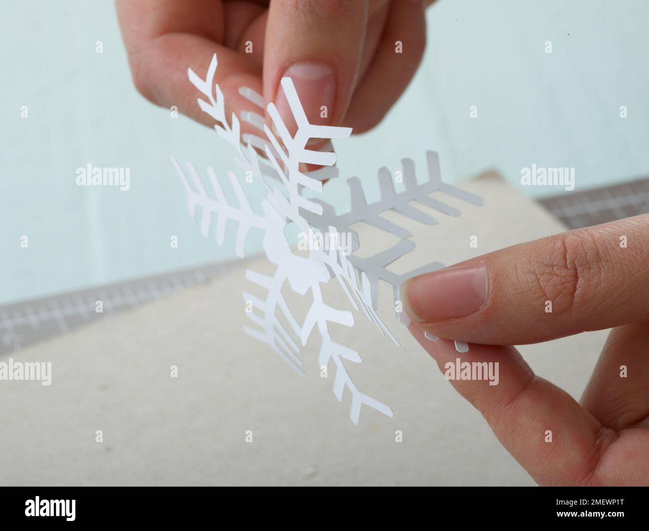 Papercraft Paper snowflake bauble steps Stock Photo - Alamy