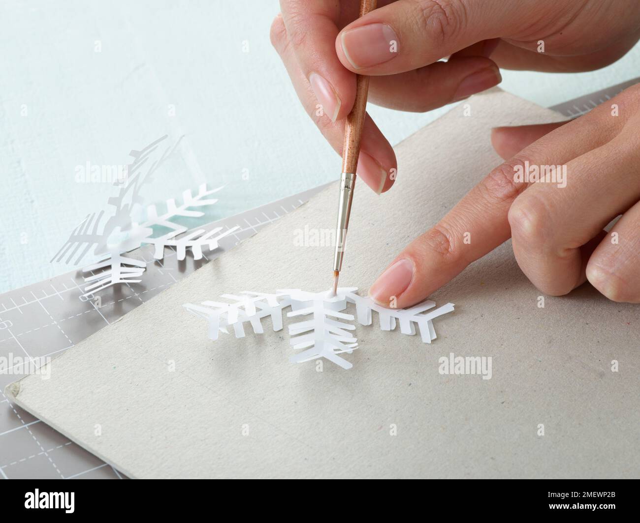 Papercraft Paper snowflake bauble steps Stock Photo - Alamy