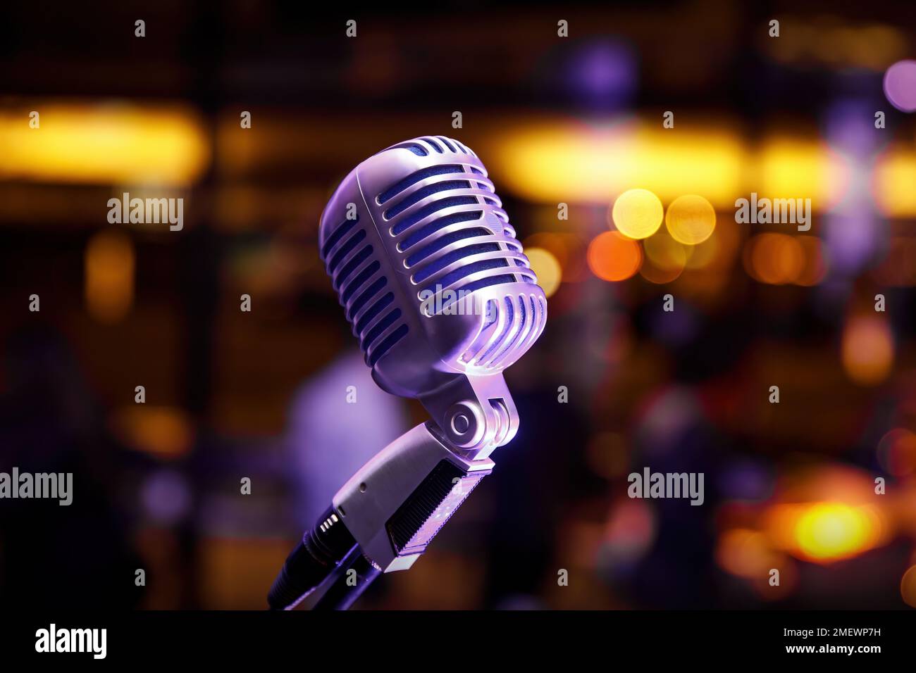 Retro microphone on the stage. Mic and blurred festive bokeh Stock ...
