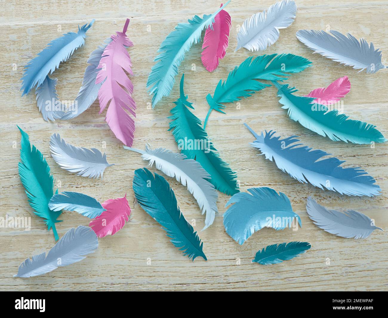 Papercraft Paper feather gift wrap Stock Photo - Alamy