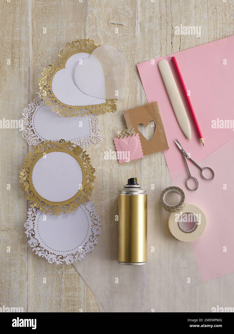 Papercraft. Guilded doily and embossed card equipment shot Stock Photo ...