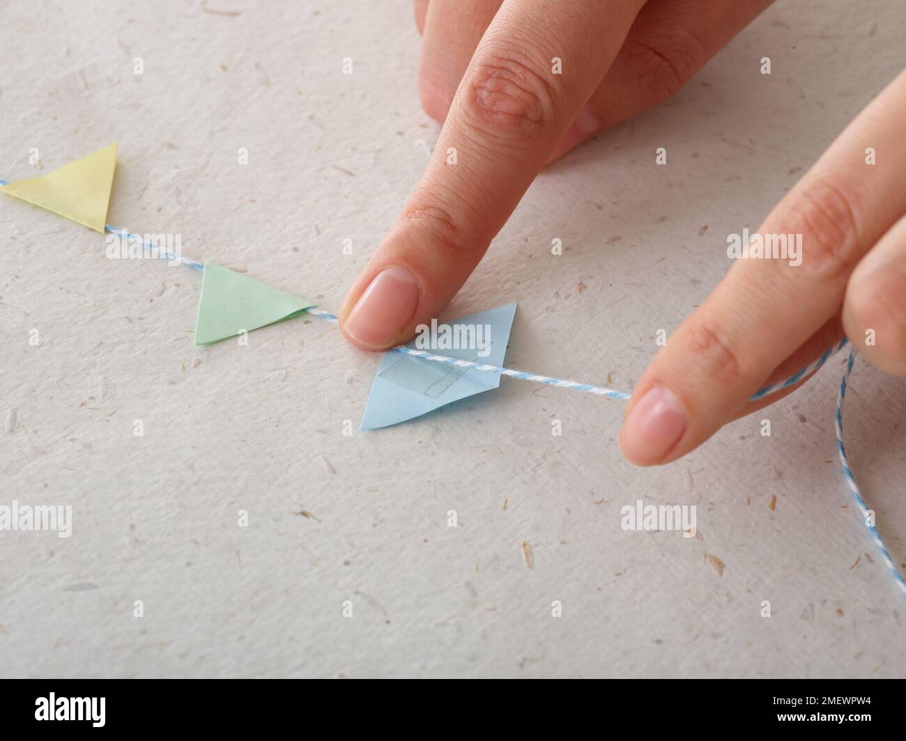 Papercraft. Paper bunting step 3. Attaching paper piece to bunting ...