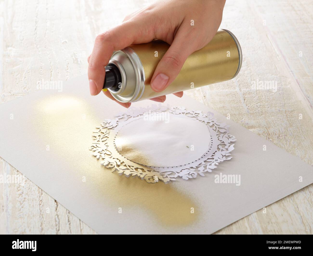 Papercraft. DIY doily guilding step 2. With template stuck in place ...