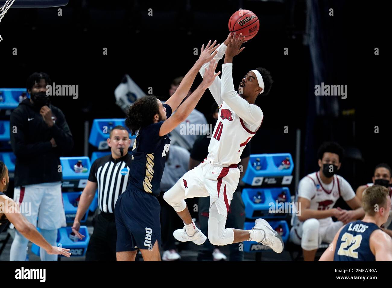 Arkansas guard Jalen Tate (11) drives to the basket over Oral Roberts ...