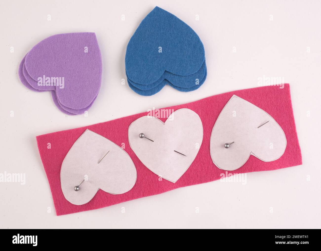 Using template before cutting out felt hearts for bunting Stock Photo ...