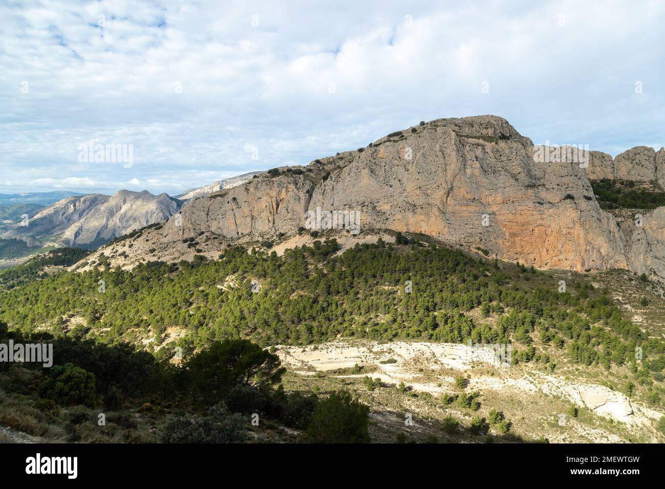 walking route PR CV 017 underneath the cliffs of Penyo Cabal Mountain, Alicante, Spain Stock ...