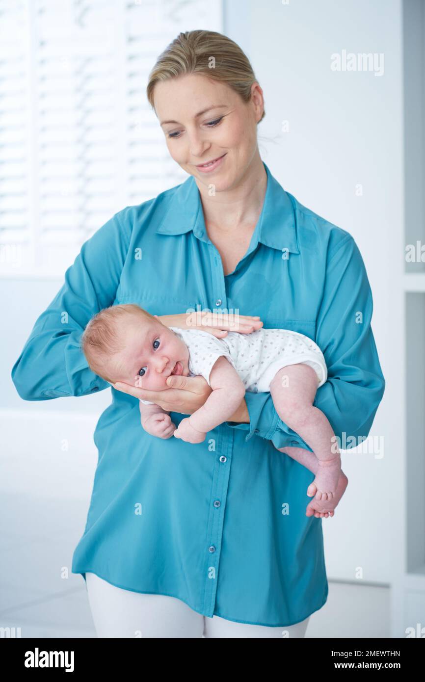 Mother holding six week baby Stock Photo - Alamy