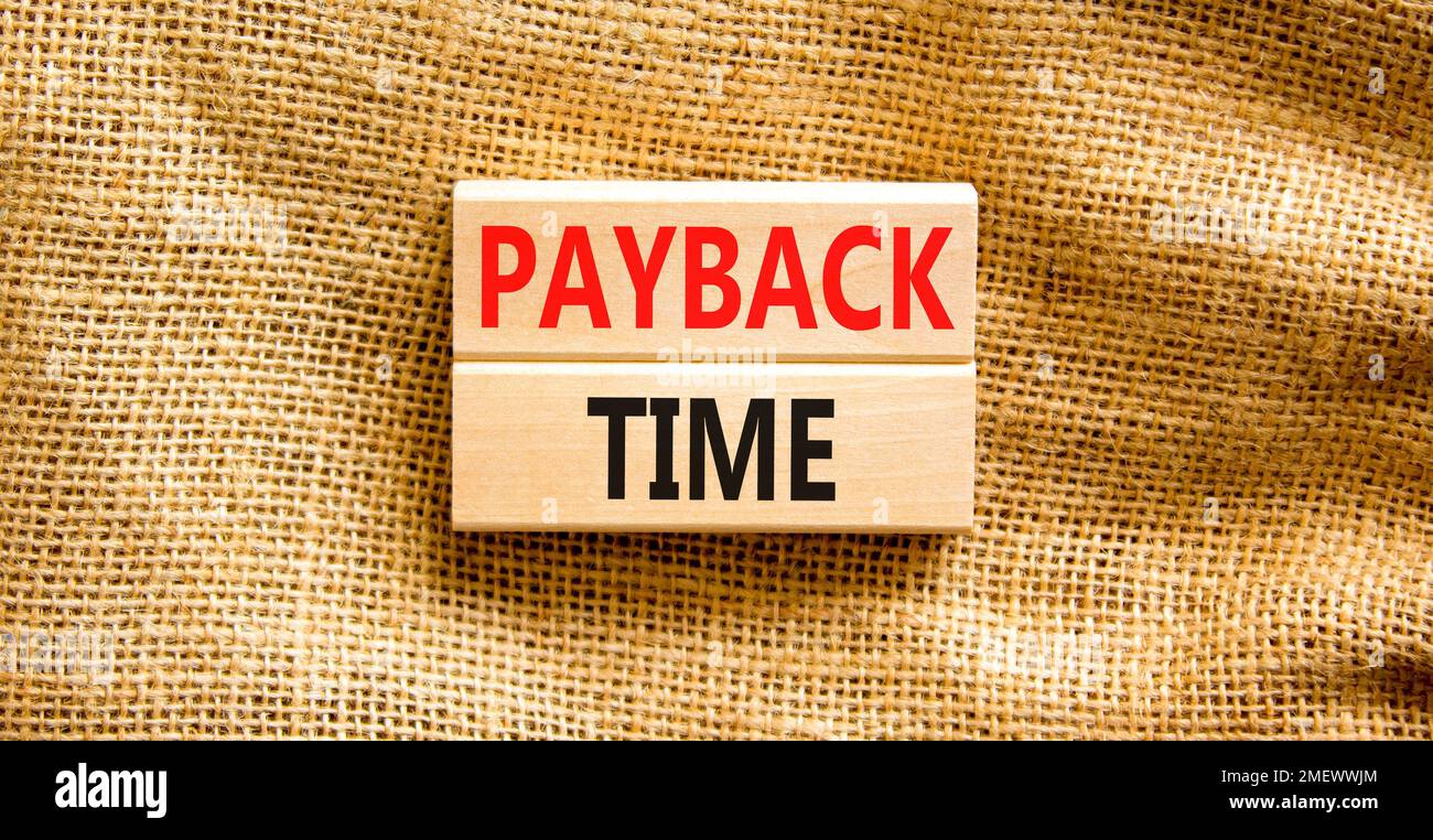 Payback time symbol. Concept words Payback time on wooden blocks ...