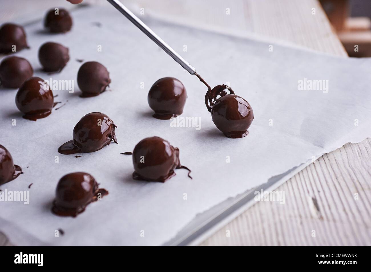 Rolling and dipping truffles Stock Photo - Alamy