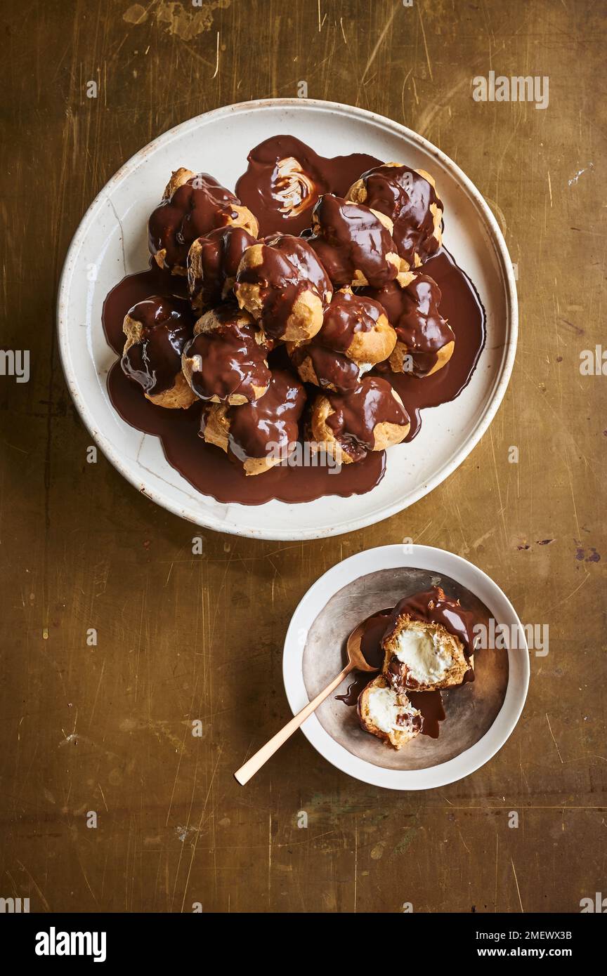 Chocolate profiteroles with Chantilly cream Stock Photo - Alamy