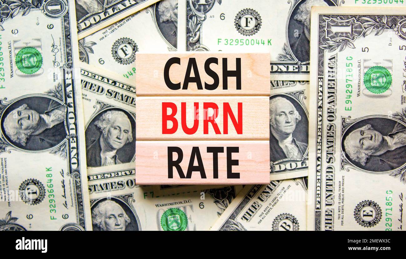 Cash burn rate symbol. Concept words Cash burn rate on wooden blocks on ...