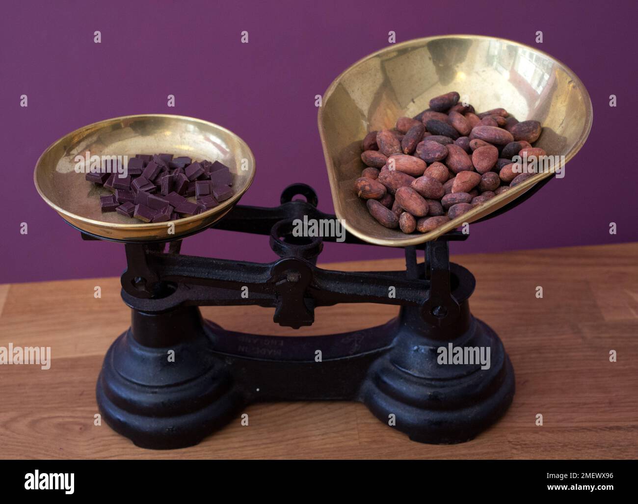 Chocolate bars and cocoa beans on scales Stock Photo - Alamy