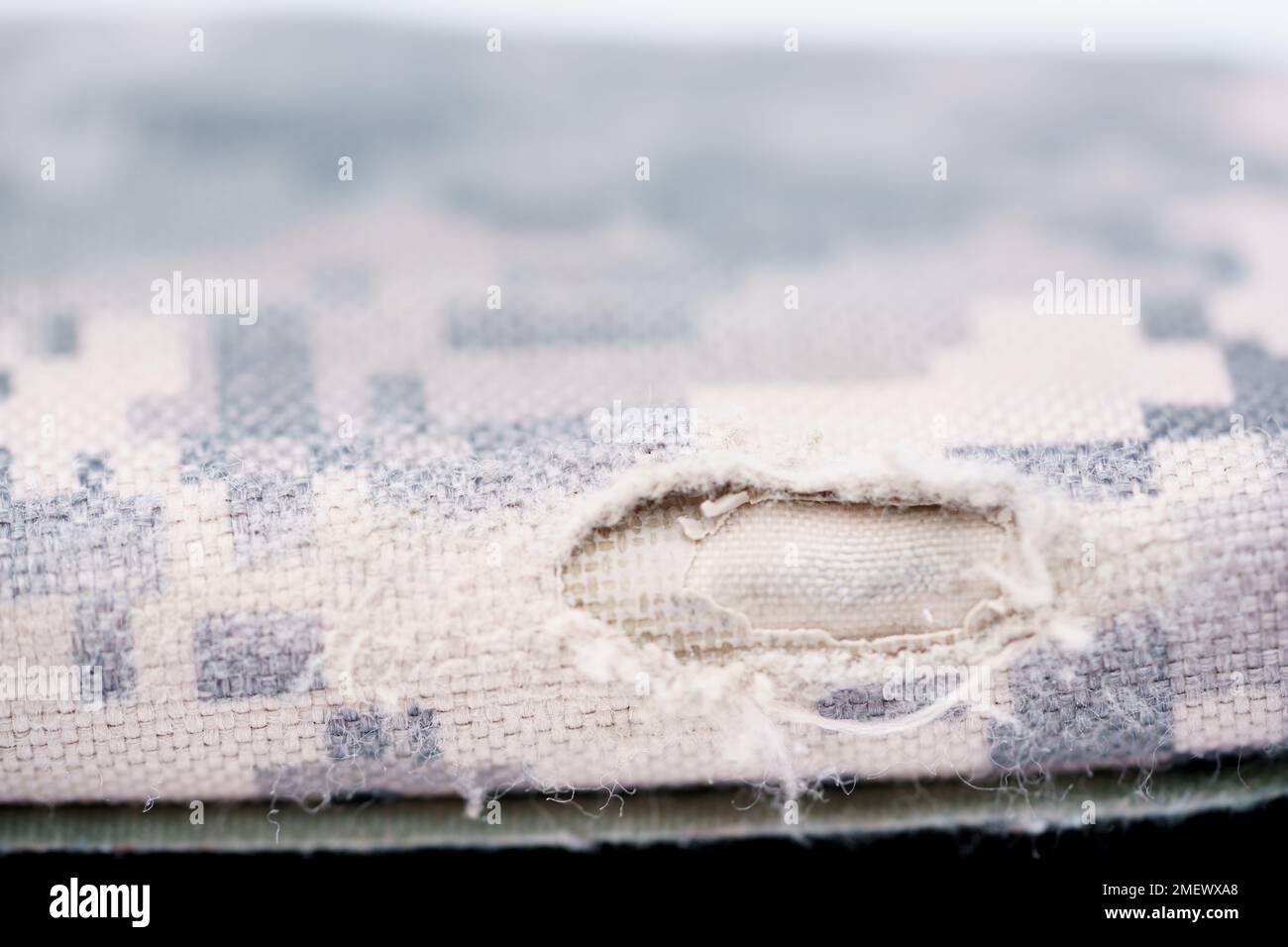 Ripped and torn army camouflage Stock Photo - Alamy