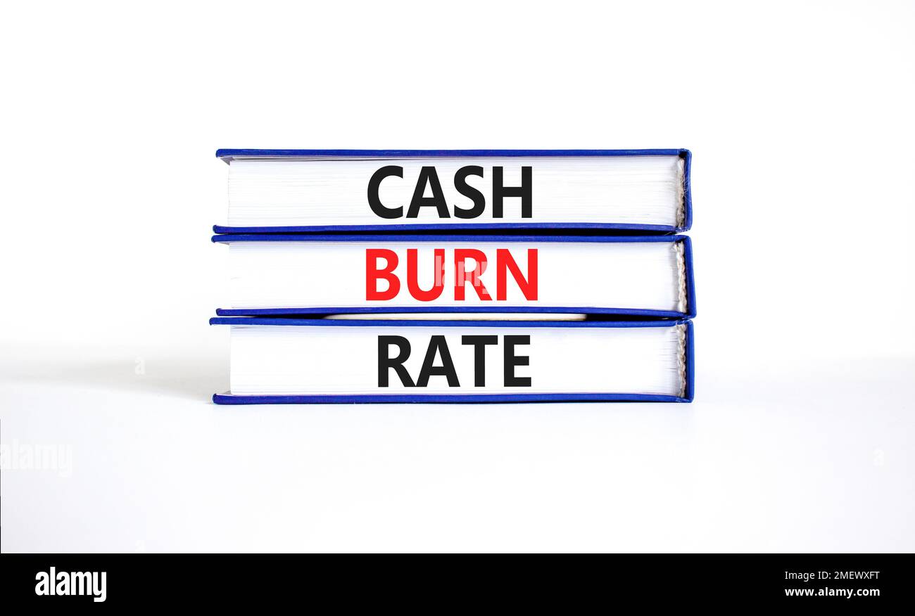 Cash burn rate symbol. Concept words Cash burn rate on books on a ...