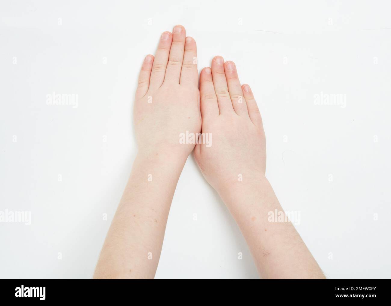 Children's hands demonstrating the movement of tectonic plates ...