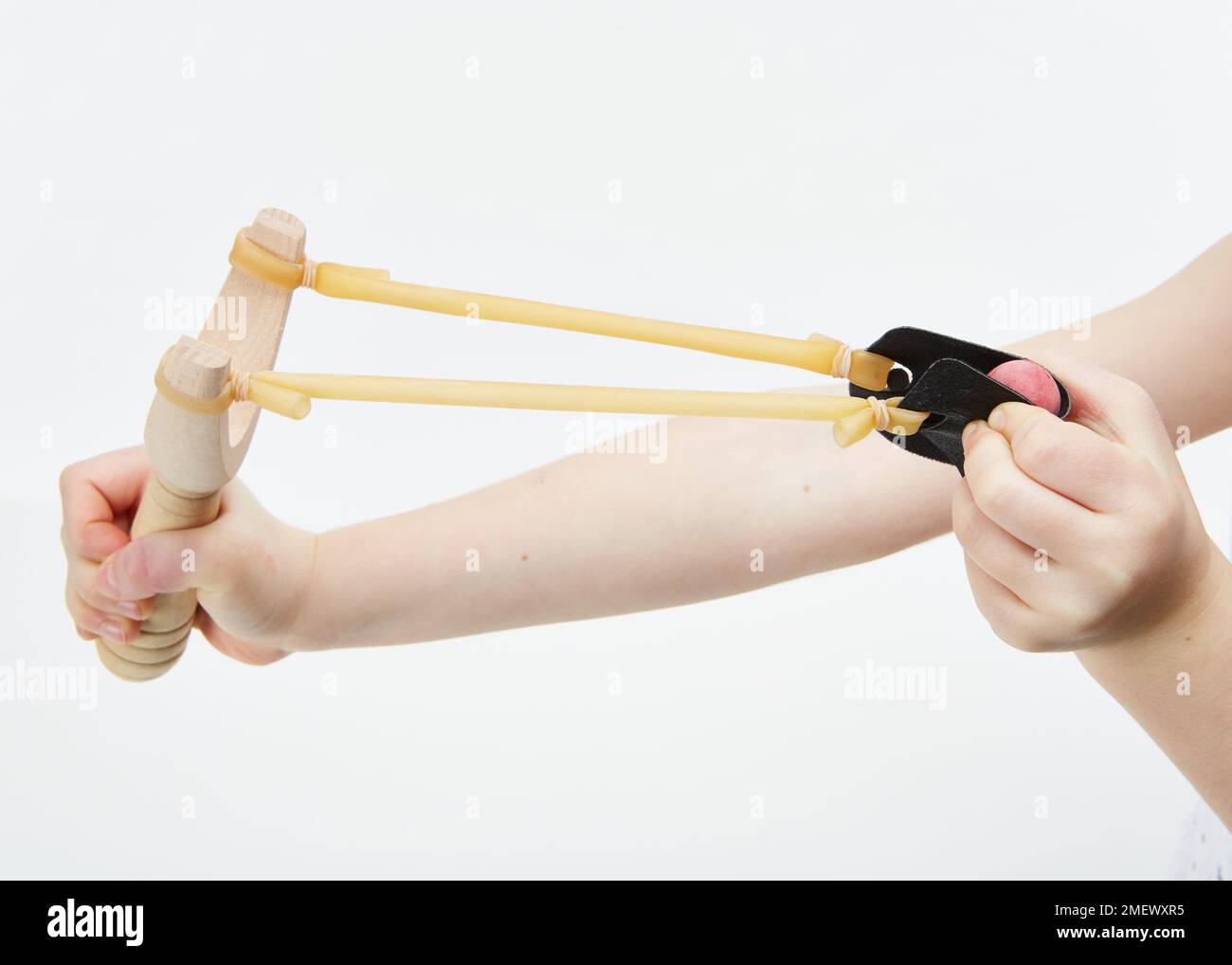 Child playing with toy slingshot Stock Photo - Alamy