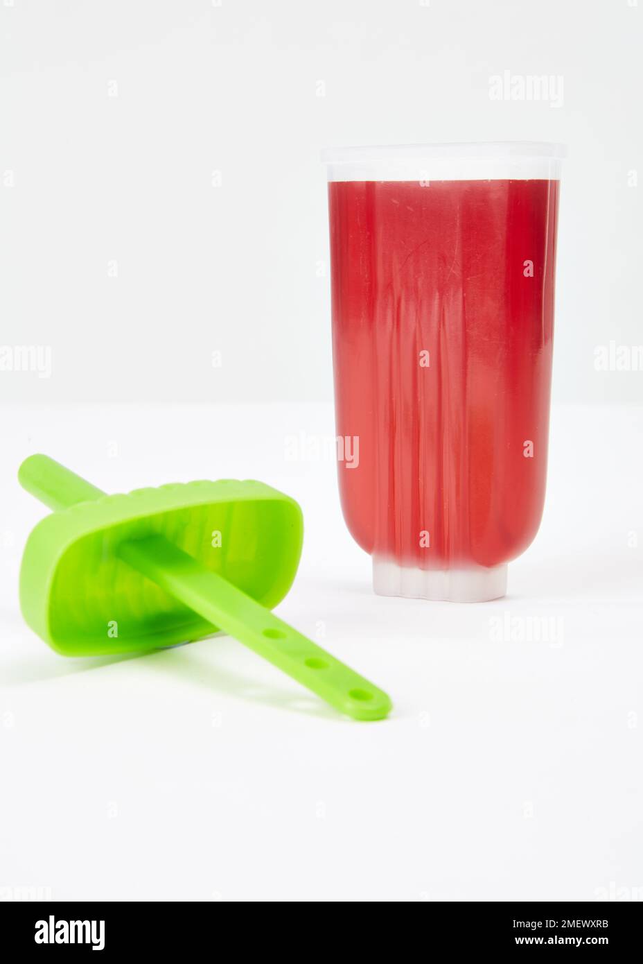 Ice lolly mould with red liquid Stock Photo - Alamy