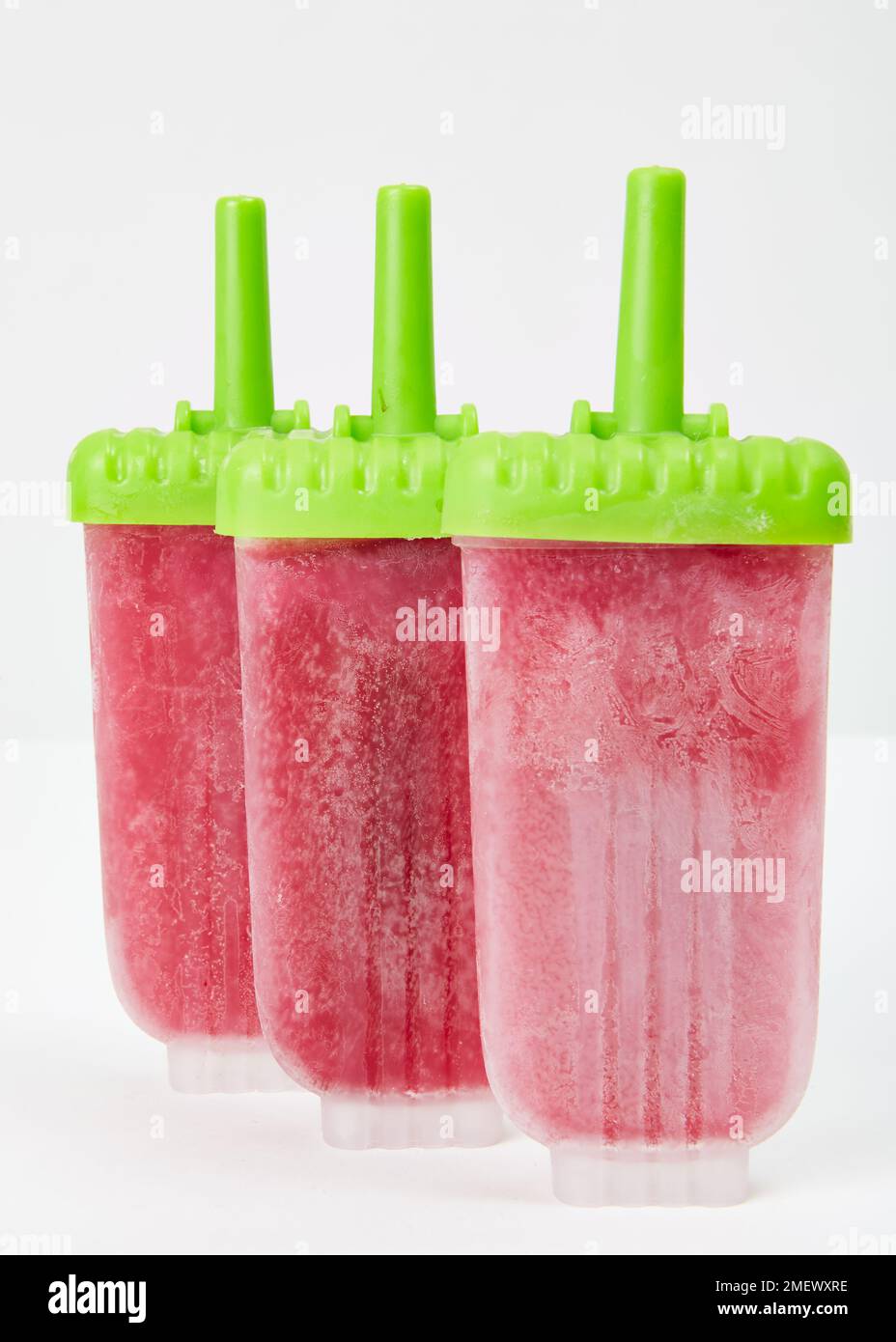 Frozen ice lollies with green handles Stock Photo - Alamy