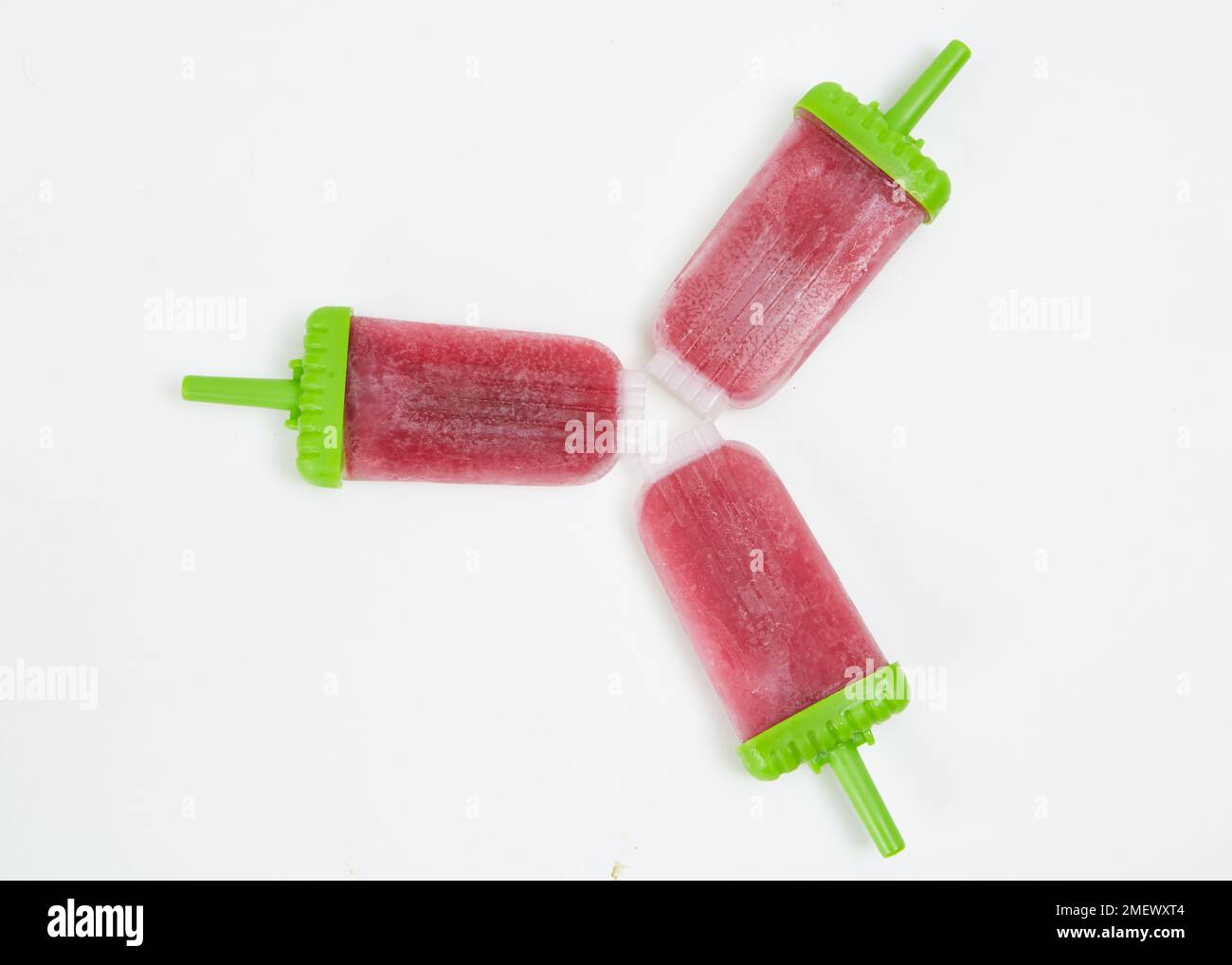 Frozen ice lollies with green handles Stock Photo - Alamy