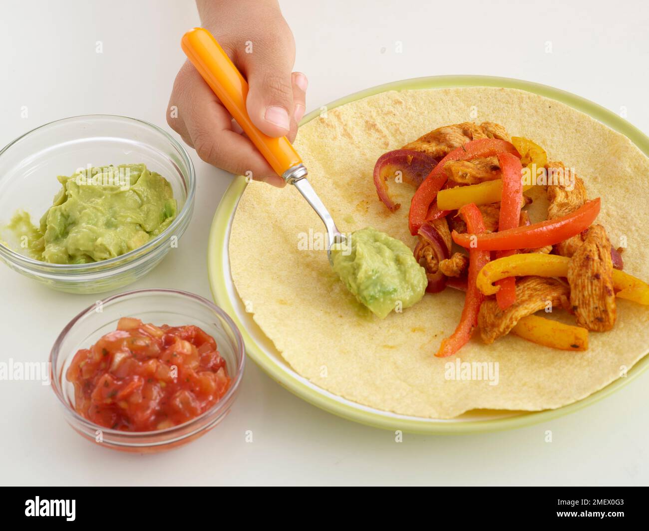 steps for chicken fajitas, step 5 Stock Photo - Alamy
