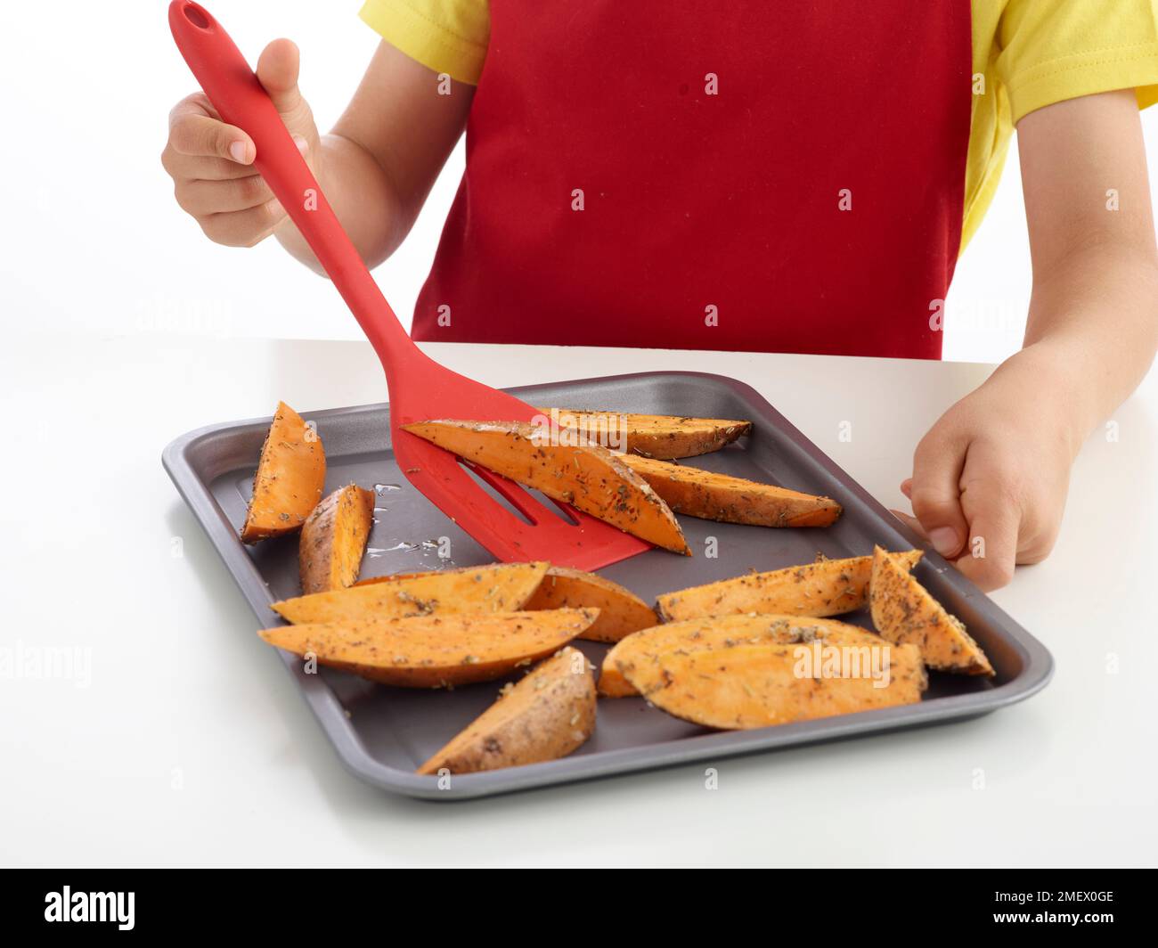 steps for sweet potato wedges, step 3 Stock Photo - Alamy