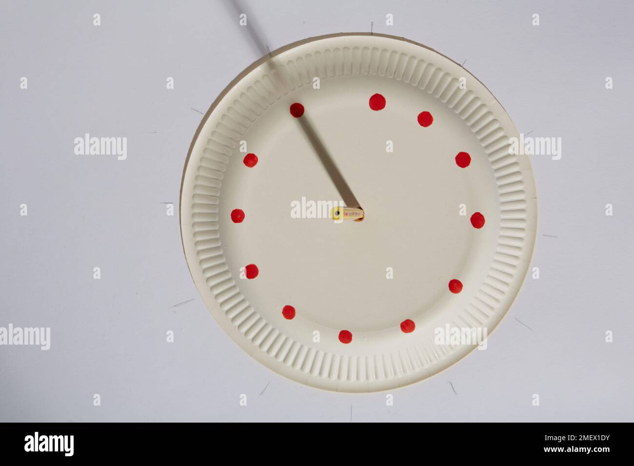 Creating a homemade sundial with a pencil and a paper plate Stock Photo ...