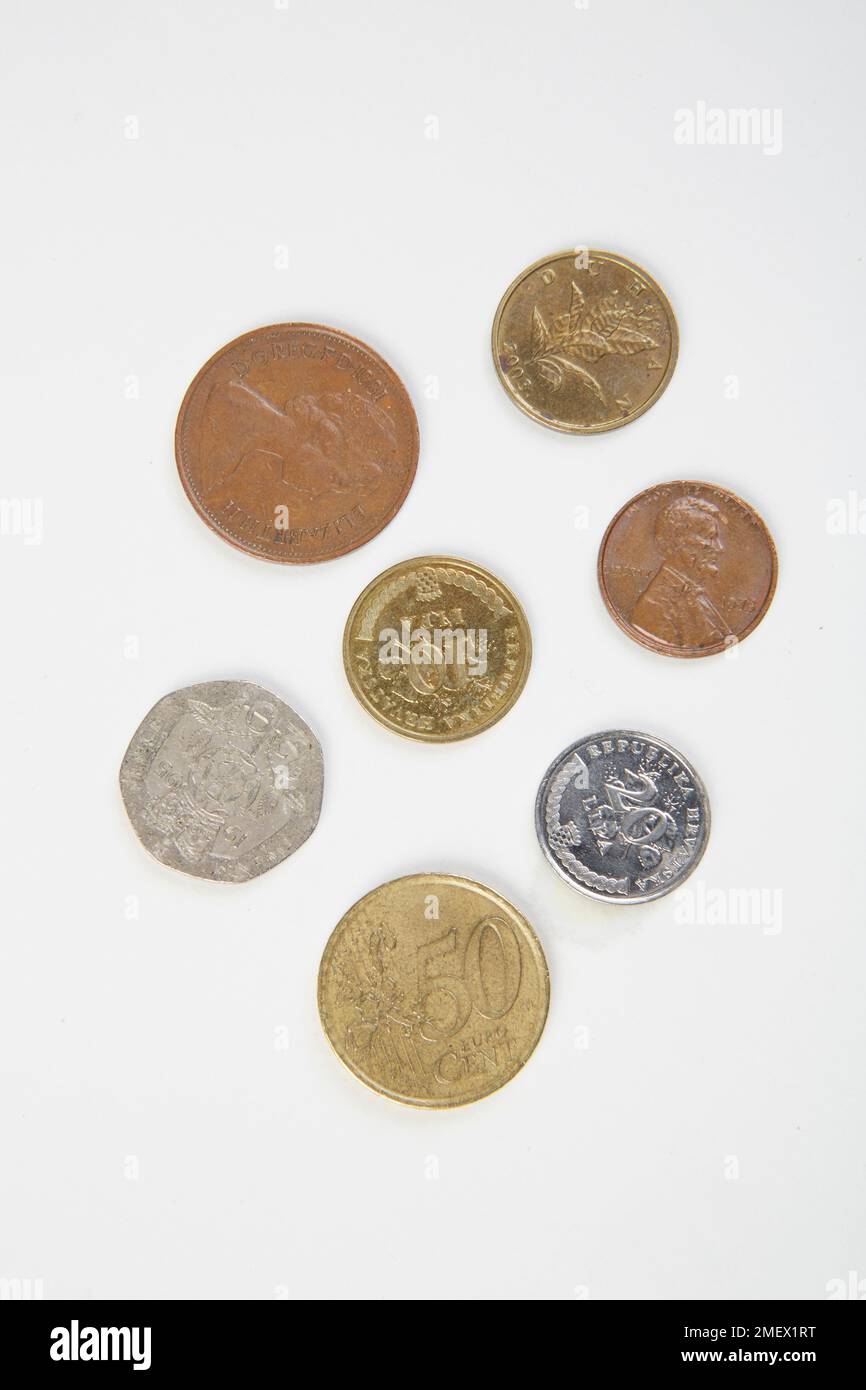 One pound, one penny, two pence, twenty pence and five pence coins ...