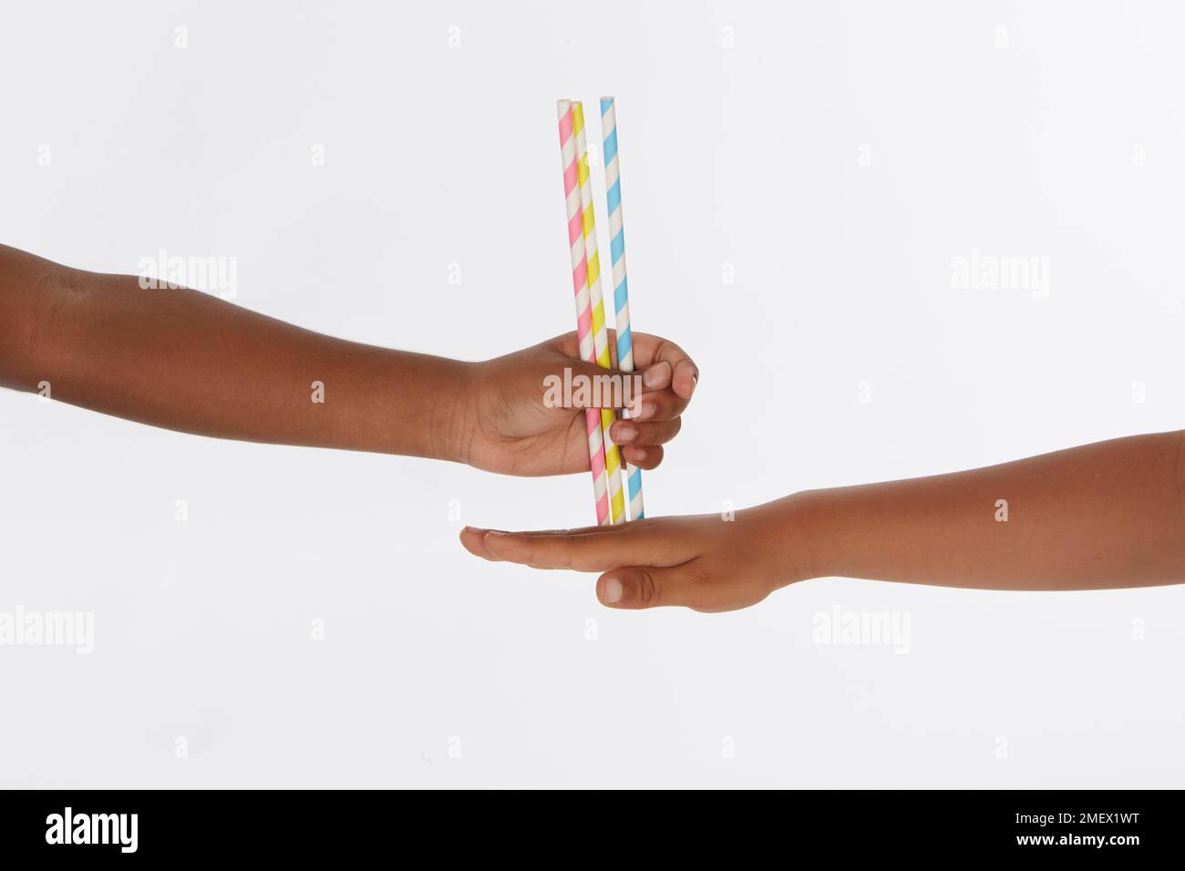 Straws being used on different areas of the skin on hands as a nerves ...