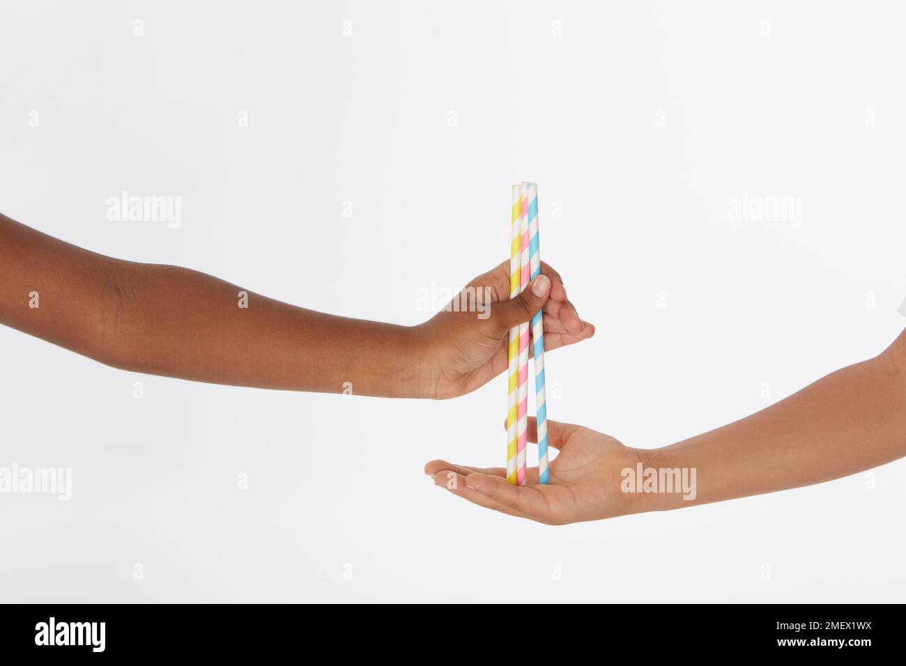 Straws testing nerves on the palm of a child's hand Stock Photo - Alamy