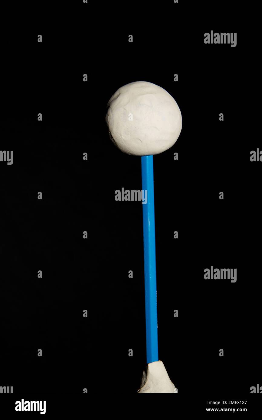 Plasticine model of the Earth's Moon on the end of a pencil Stock Photo ...