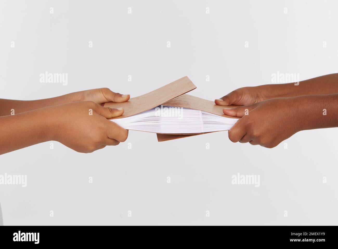 Paper in notebooks is pushed and pulled as part of a friction test ...