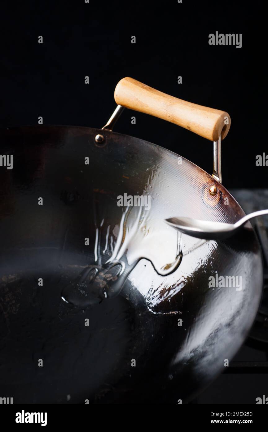 How to make the perfect veggie stir-fry, step 2: pour oil down the side ...