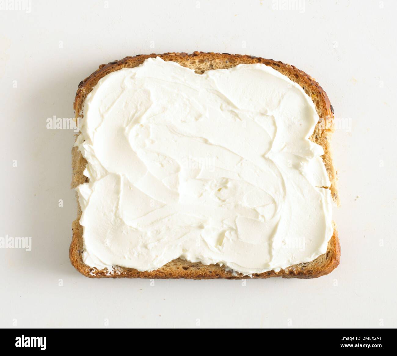 Spread on slice of bread Stock Photo - Alamy