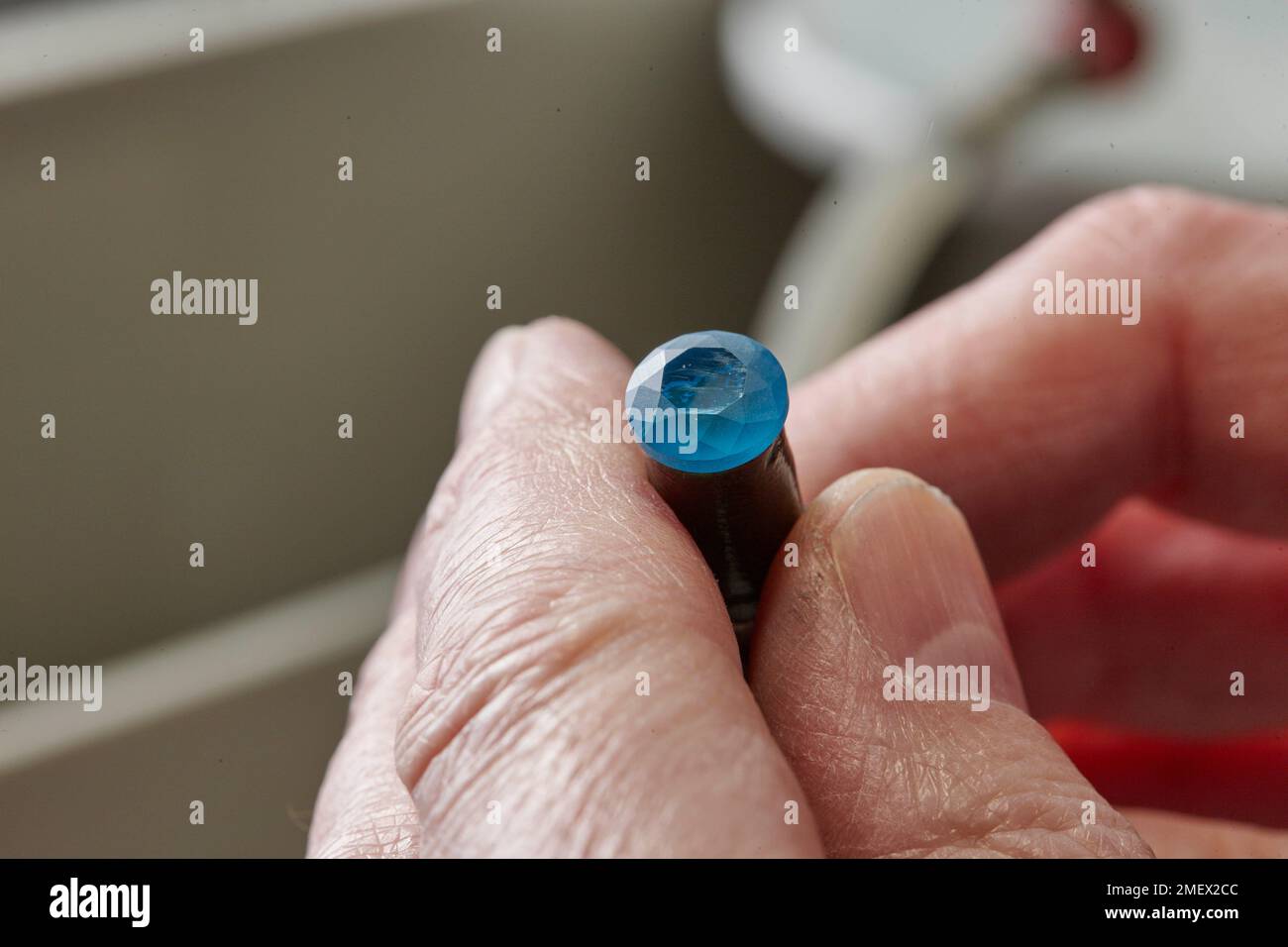 Checking the girdle of a gem Stock Photo - Alamy