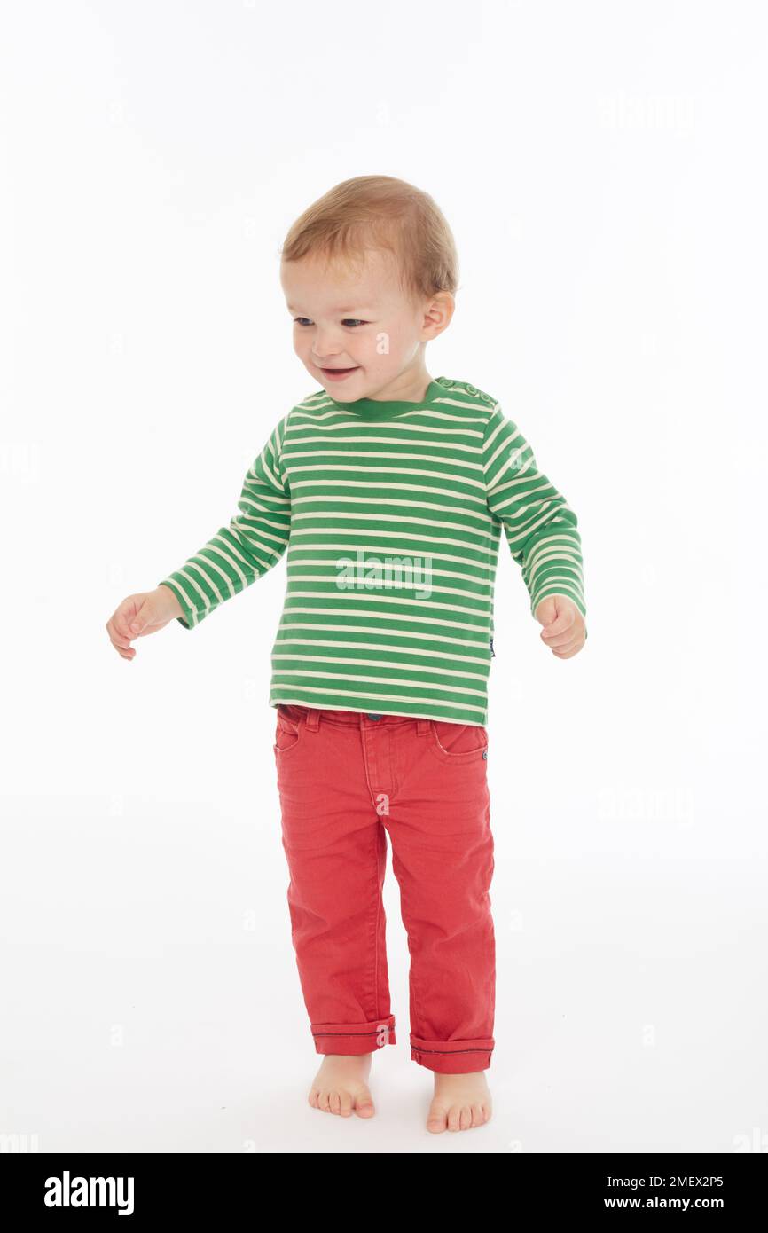 Little boy in green stripey top playing, various poses (Model age - 22 ...